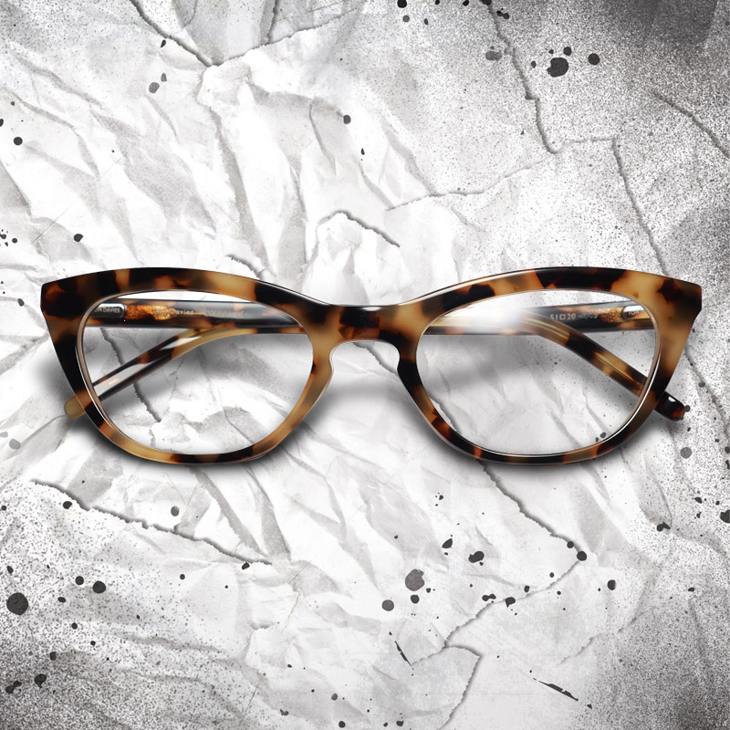 Emma Stone as Cruella wears glasses in Disney's Cruella, designed by ...